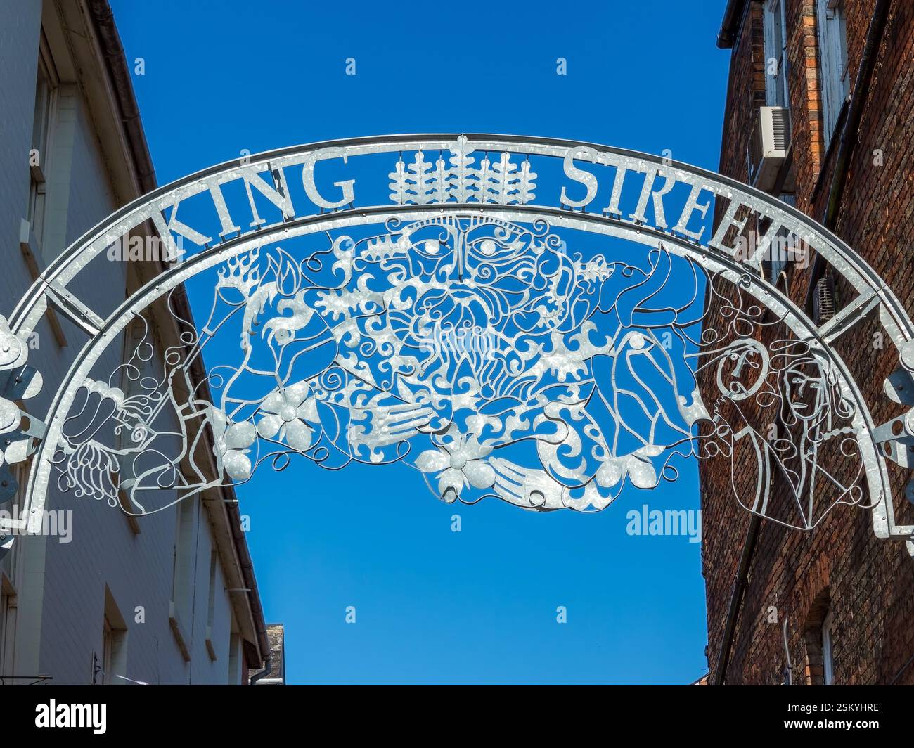 Ornate, galvanised metal arch street sign with tracery above King ...