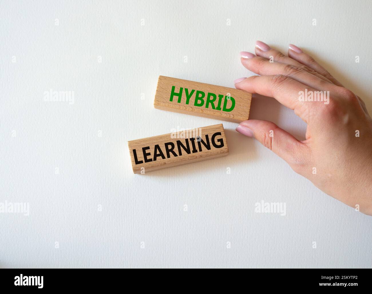 Hybrid learning symbol. Concept word Hybrid learning on wooden blocks ...