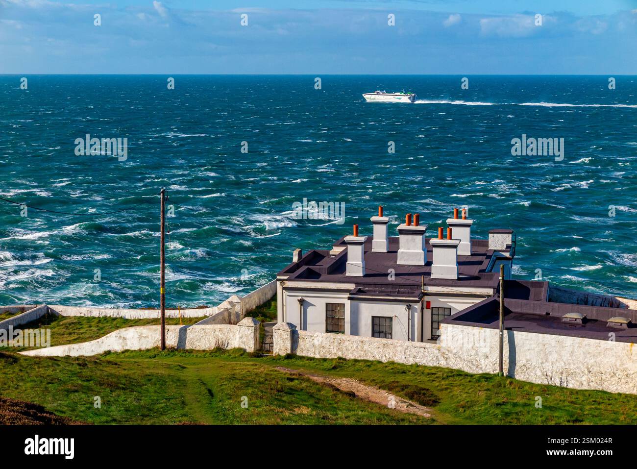 Ferry and the redundant fog warning station at North Stack on the north ...