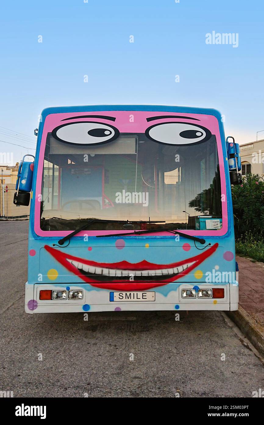 A cheerful school bus with painted funny face and a smile Stock Photo ...