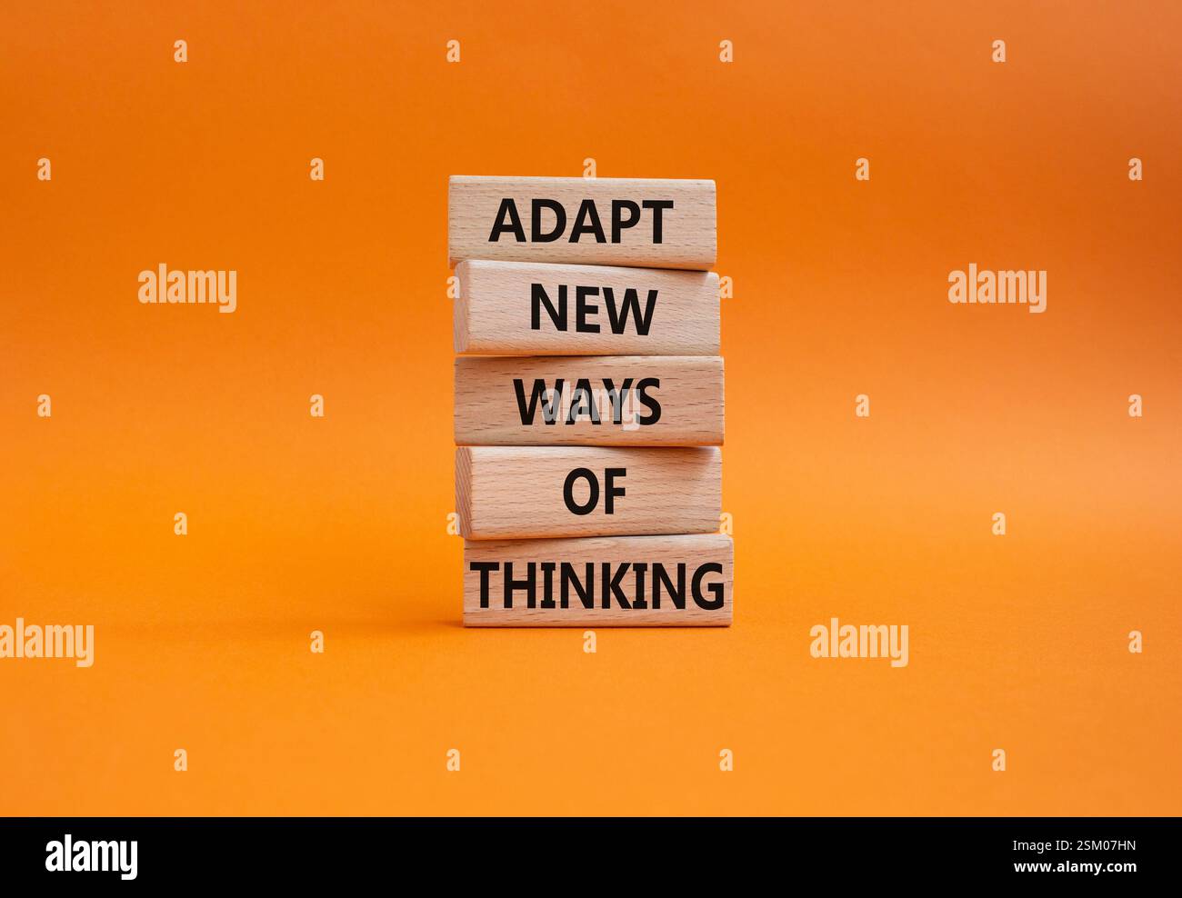 Adapt new ways of thinking symbol. Wooden blocks with words Adapt new ...