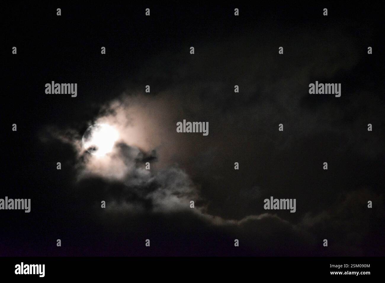 The full Snow Moon rises between the clouds in Srinagar, the summer ...