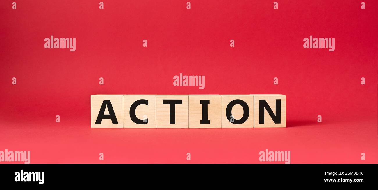 Action symbol. Concept word Action on wooden cubes. Beautiful red ...
