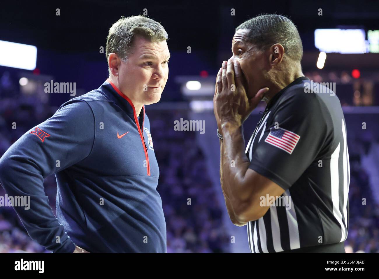 MANHATTAN, KS - FEBRUARY 11: Referee Ted Valentine whispers to Arizona ...