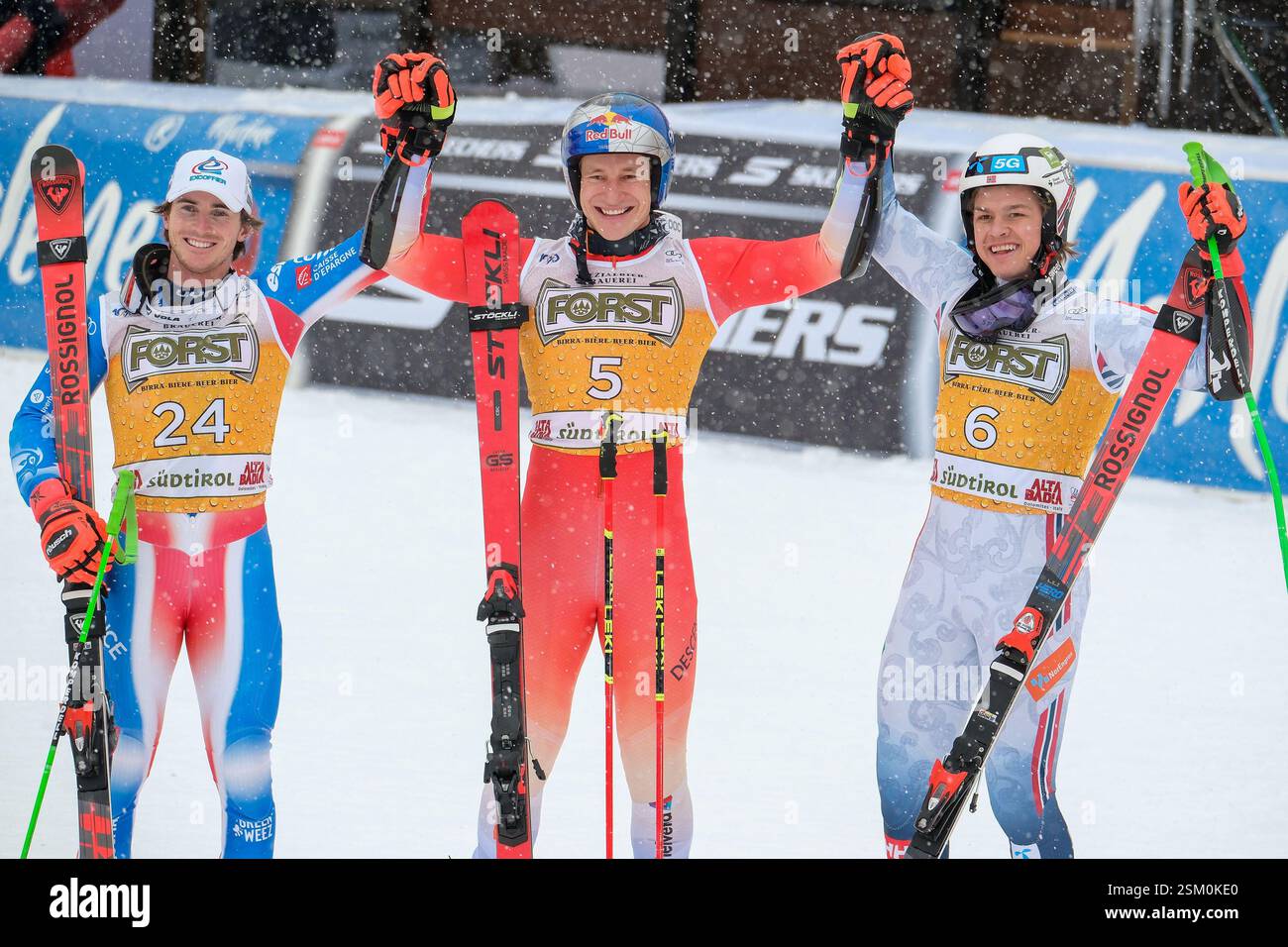 (L to R) Leo Anguenot of Team France, Marco Odermatt of Team Switzerland and Alexander Steen ...