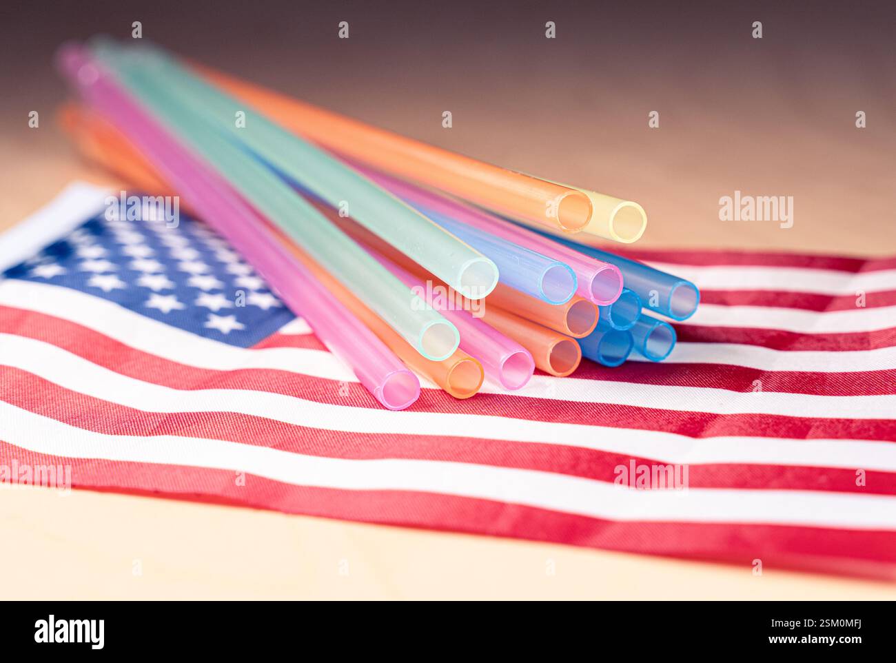 Plastic straws over a USA national Flag. Concept of Back to plastic ...