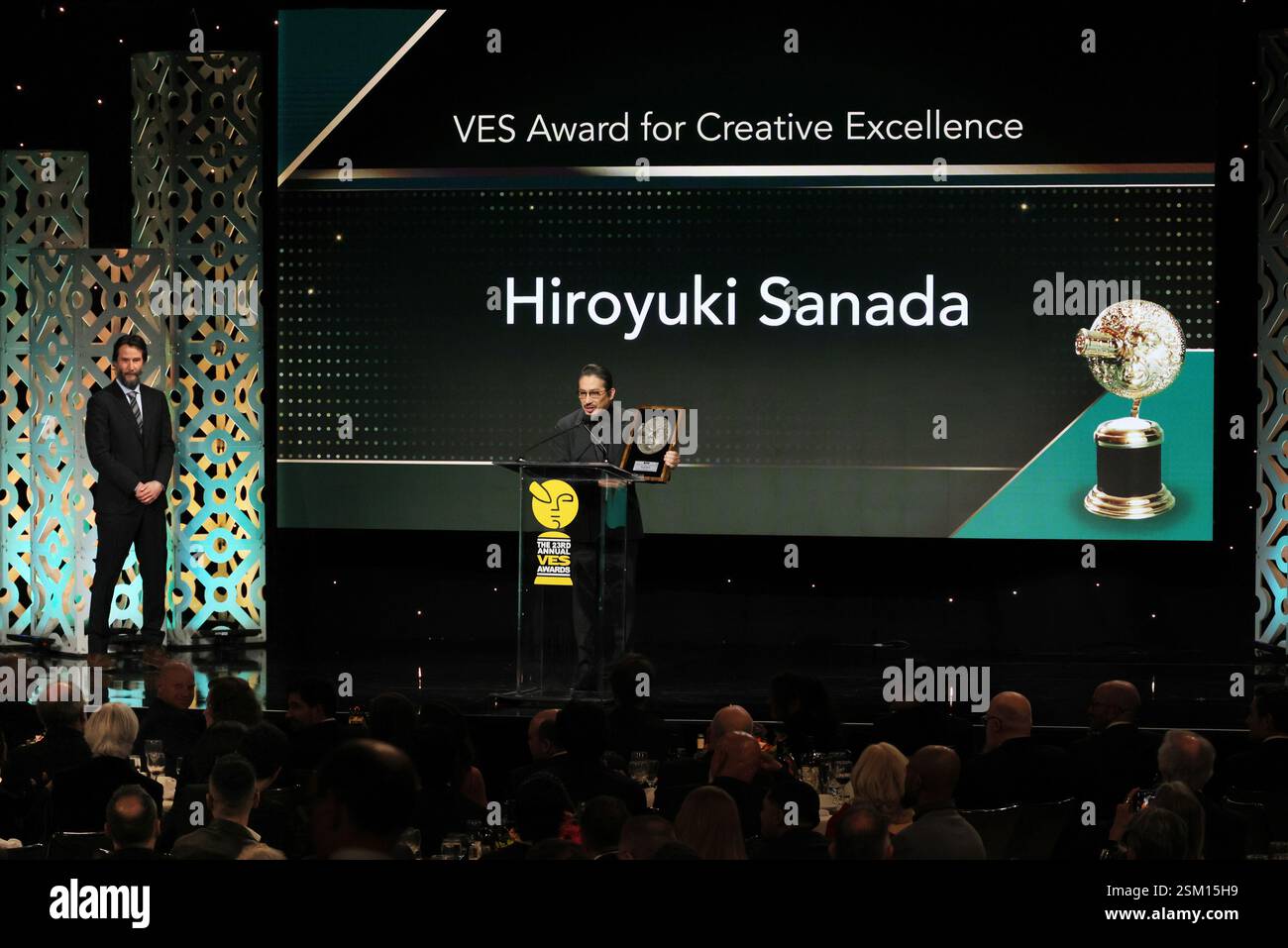 Beverly Hills, USA. 11th Feb, 2025. Hiroyuki Sanada, right, accepts the ...