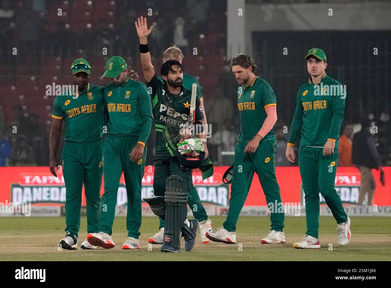 Pakistan's Mohammad Rizwan, center, acknowledges crowd after winning as ...