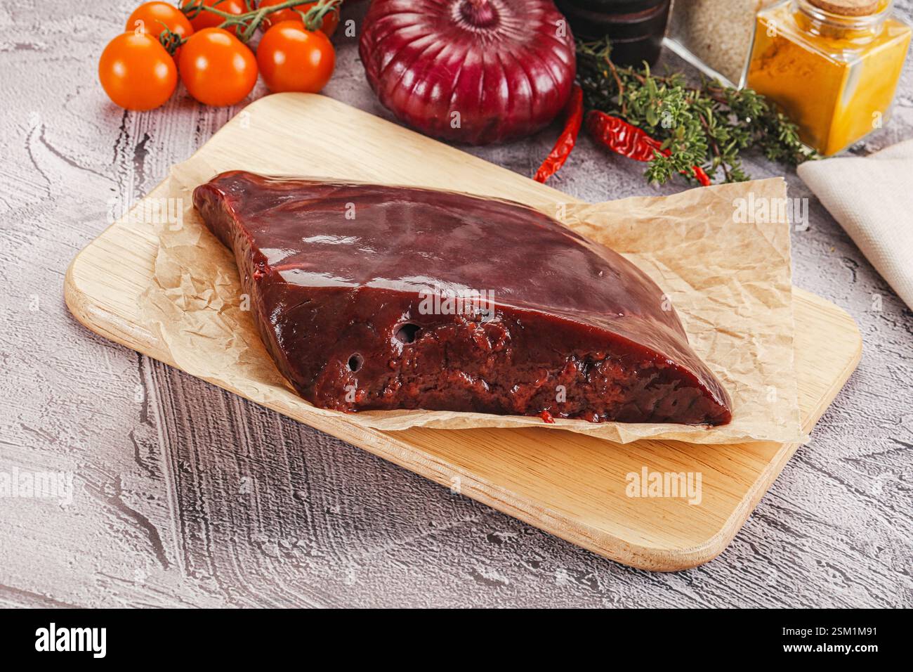 Raw beef liver piece for cooking Stock Photo - Alamy