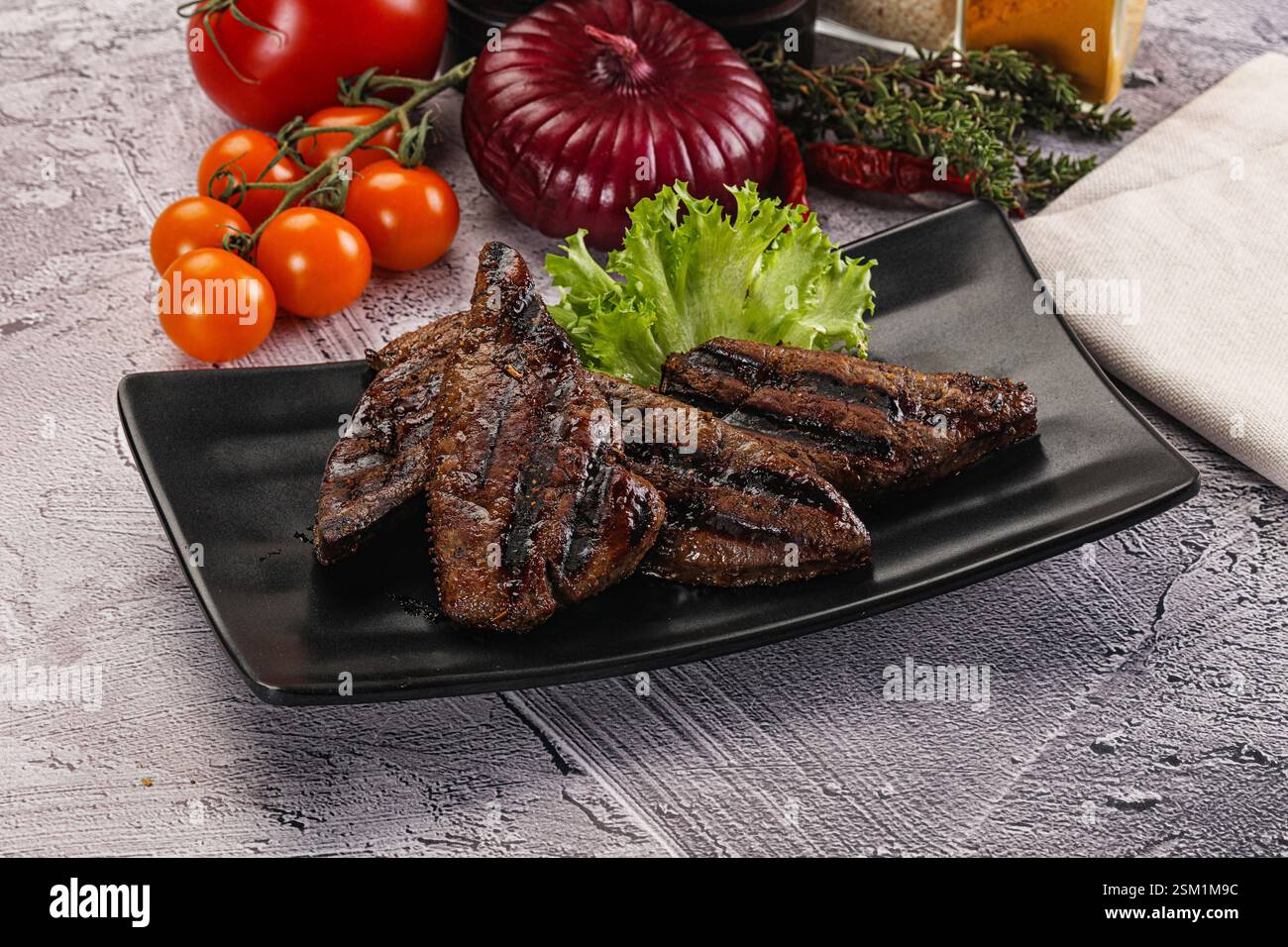 Grilled diet beef liver steak in the plate Stock Photo - Alamy
