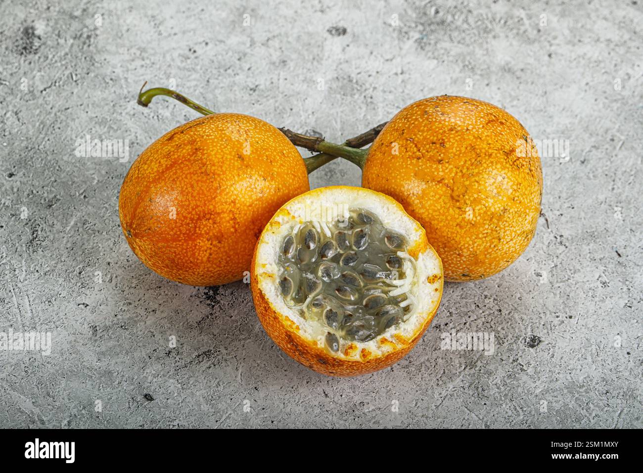 Tropical juice Granadilla Passion fruit slice Stock Photo - Alamy
