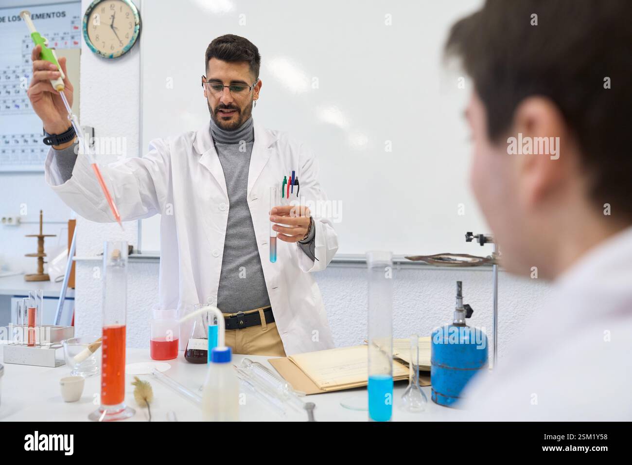 Chemistry teacher performing experiment for students institute Stock ...