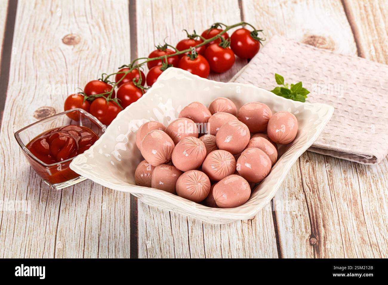 Dietary baby mini sausages for kids snack Stock Photo - Alamy