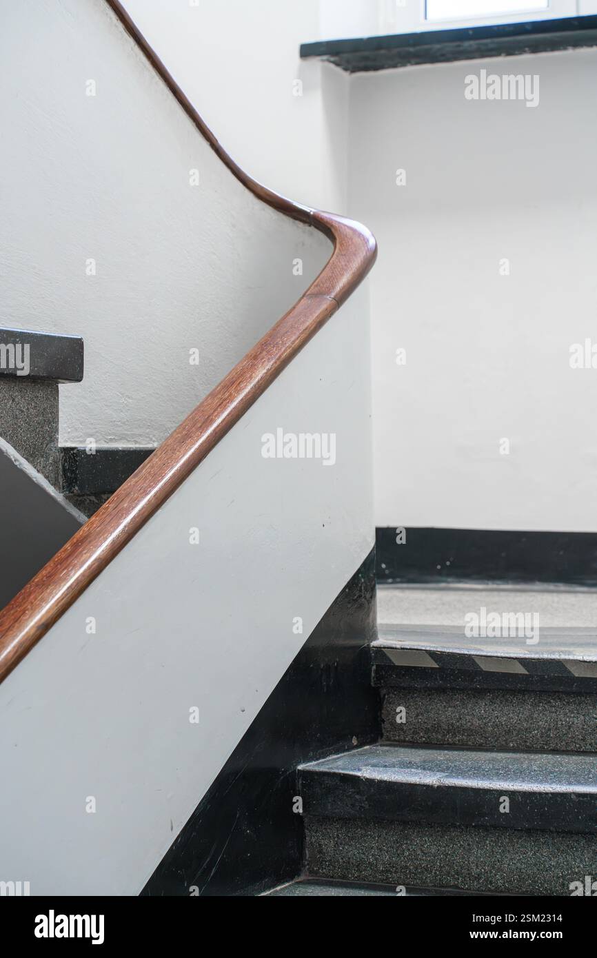 Interior of a modernist building with a beautiful white staircase ...