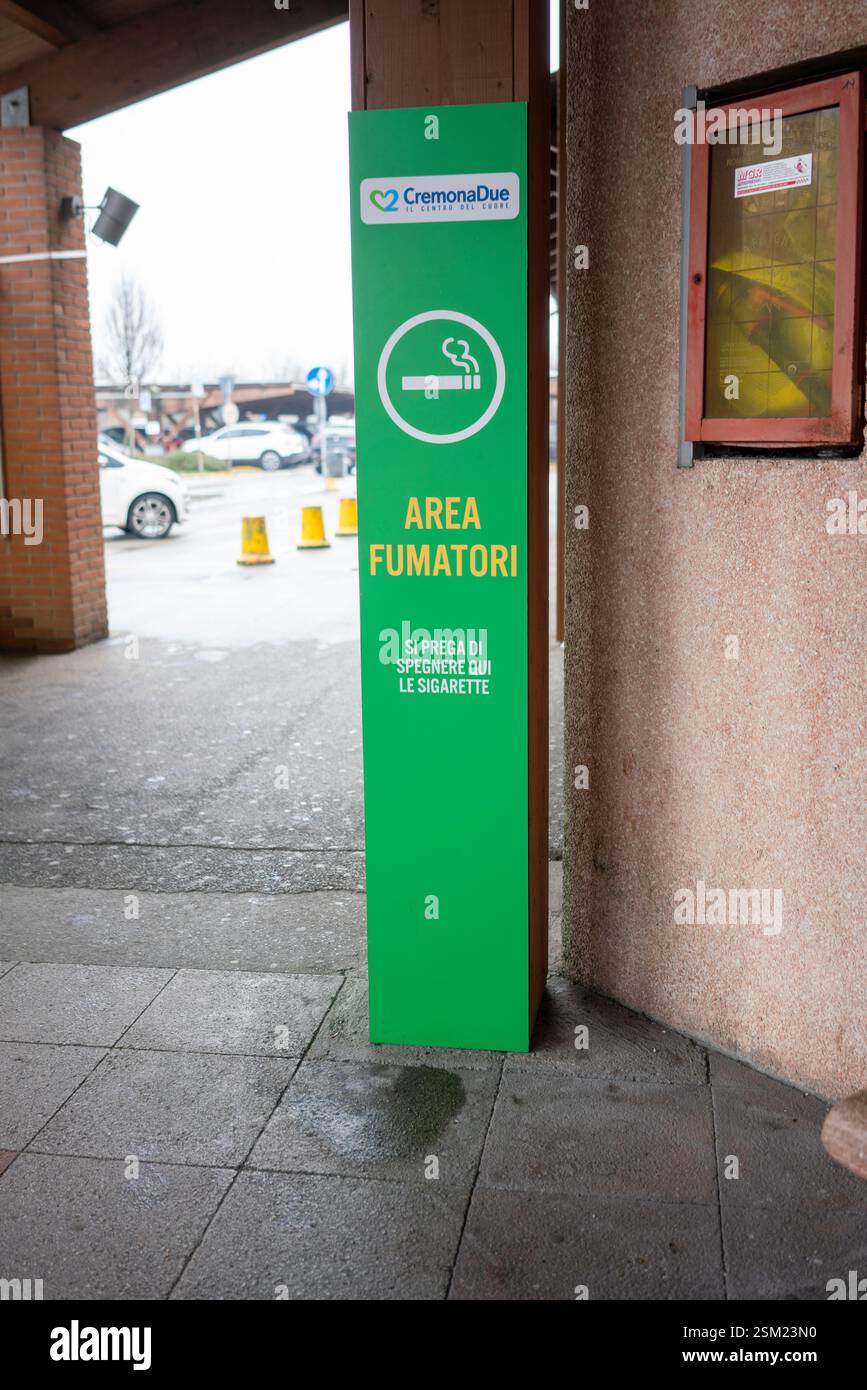 Cremona, Italy - February 8th 2024 Vertical green smoking area sign ...