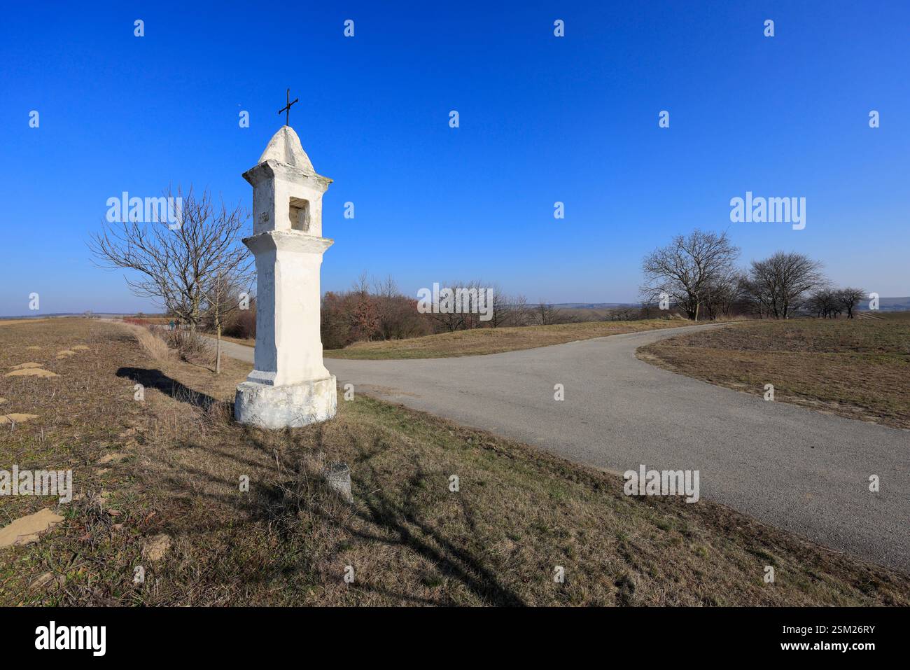 A typical saint's column on a path in the landscape of the Lower ...