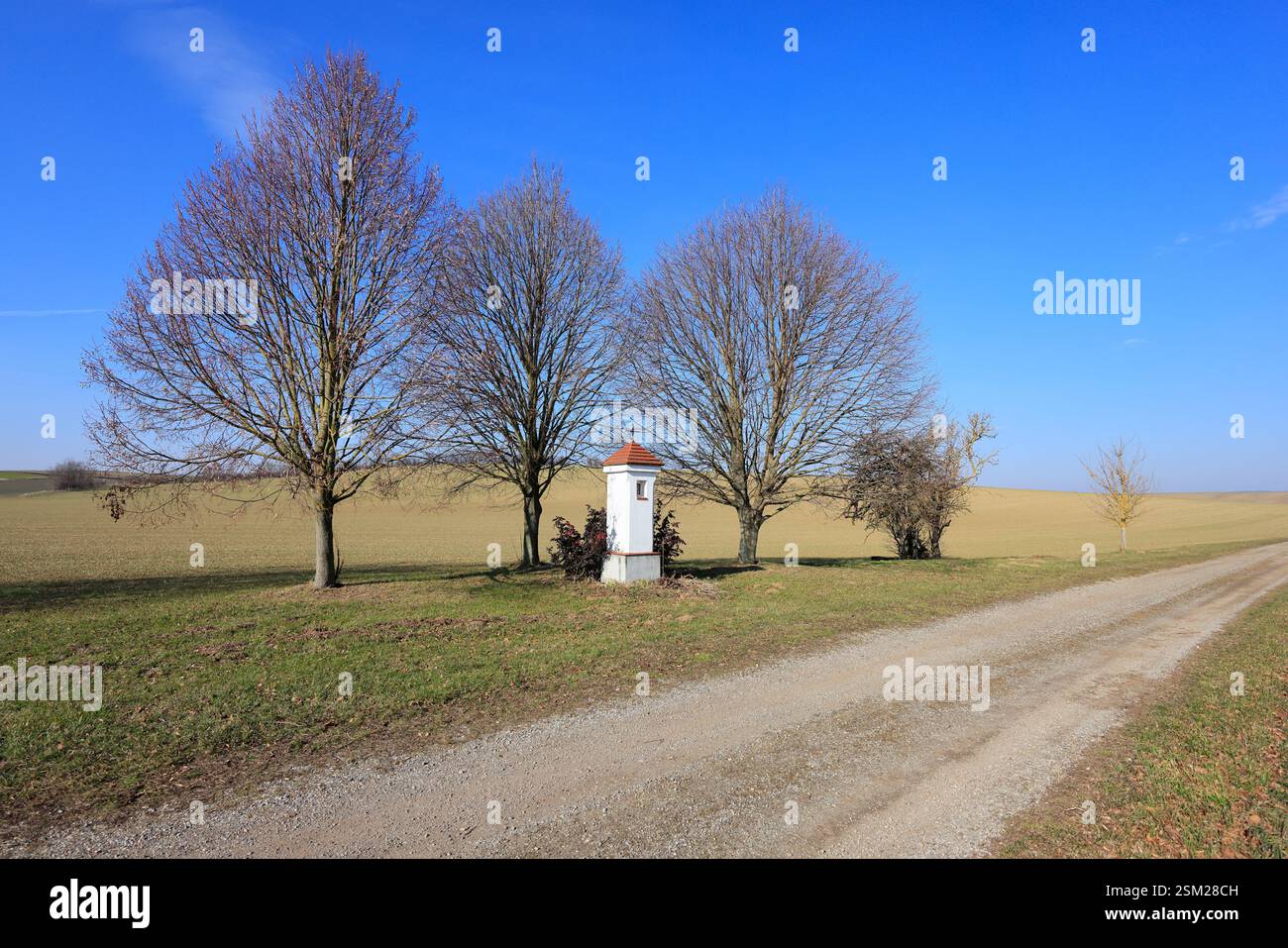 A typical saint's column on a path in the landscape of the Lower ...
