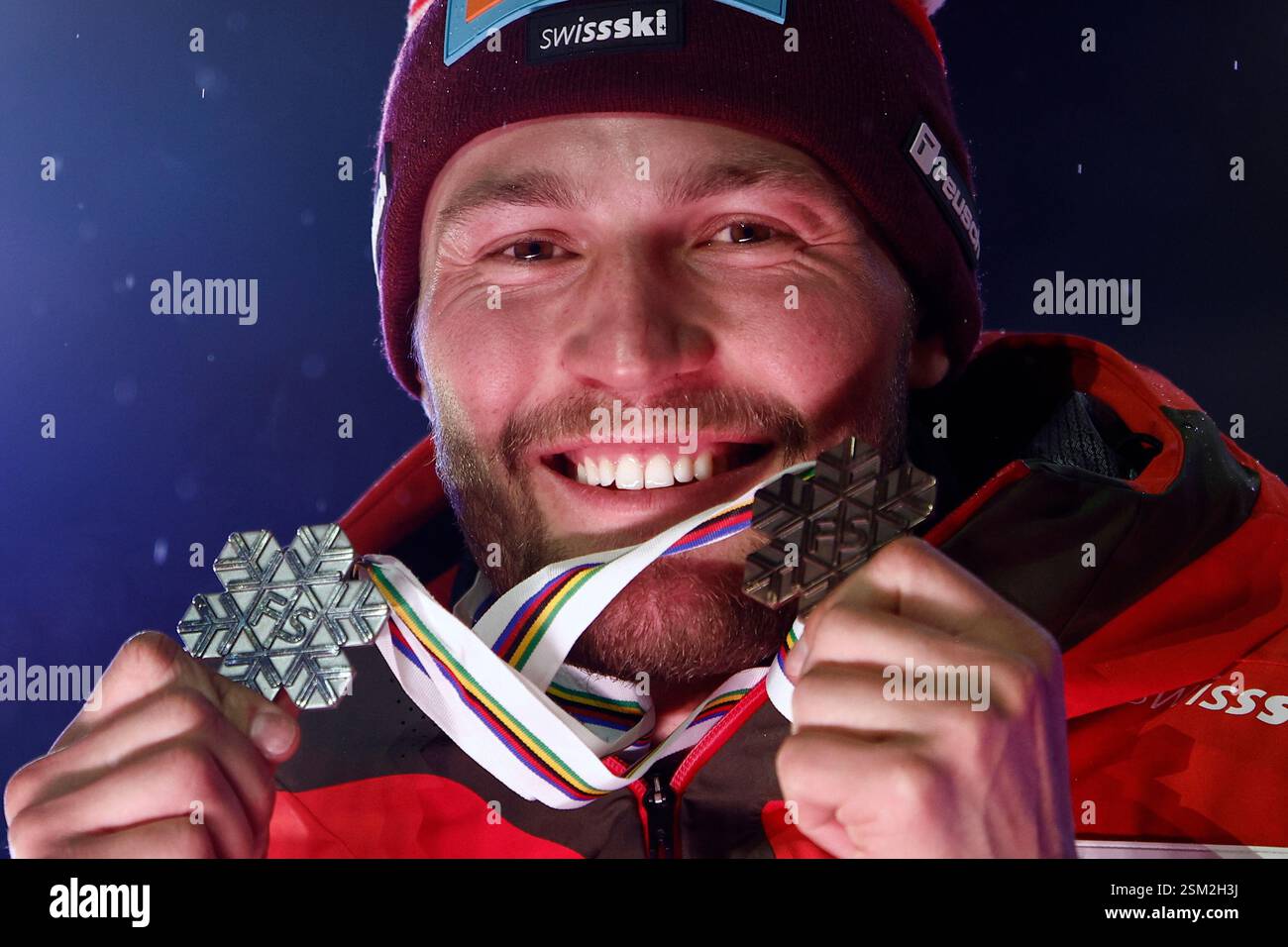Switzerland's Alexis Monney shows his silver medal for a men's team ...
