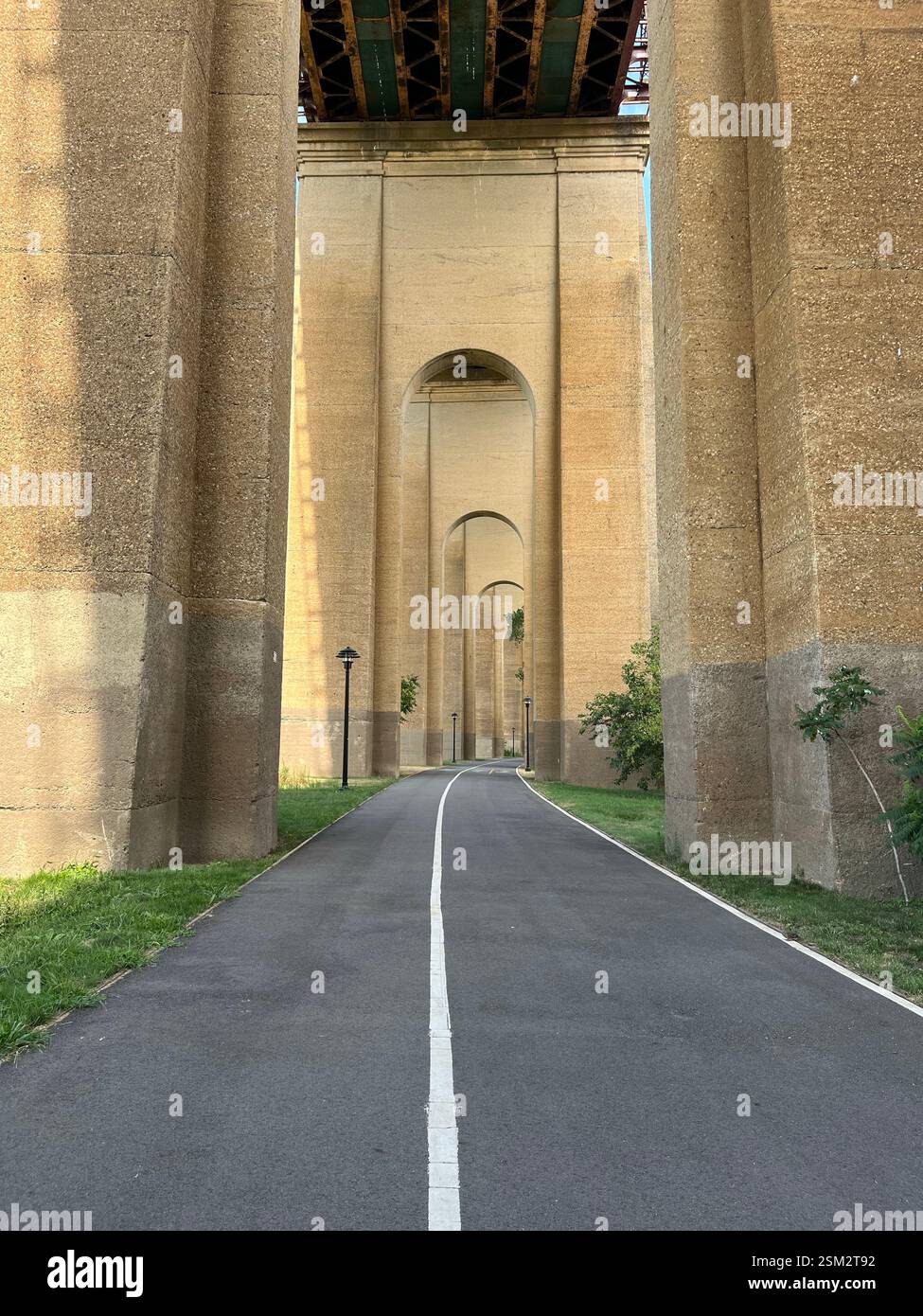 Hell Gate Bridge path on Randall’s Island in New York City Stock Photo ...