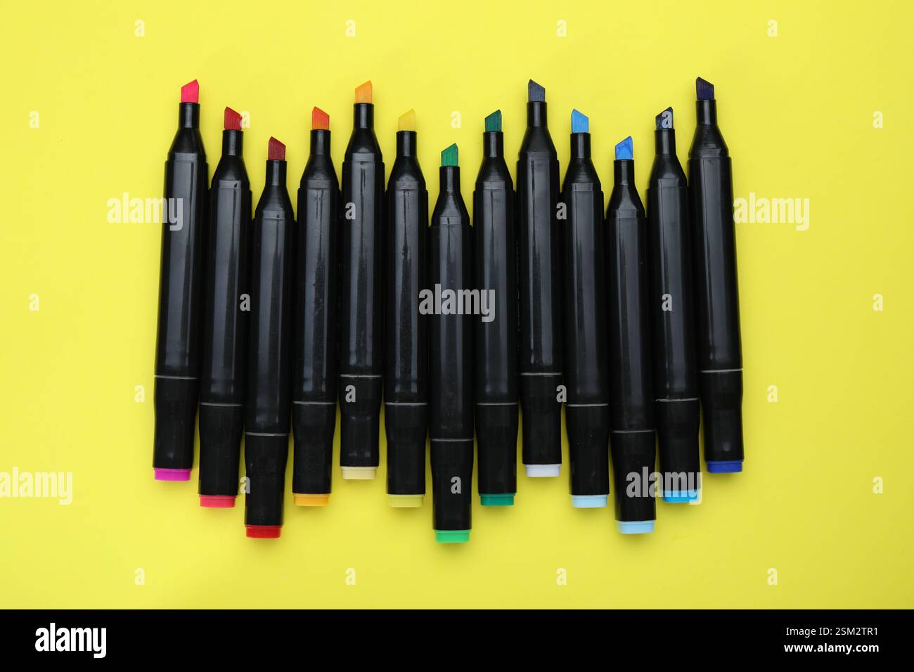 Colorful double sided markers on yellow background, top view Stock ...