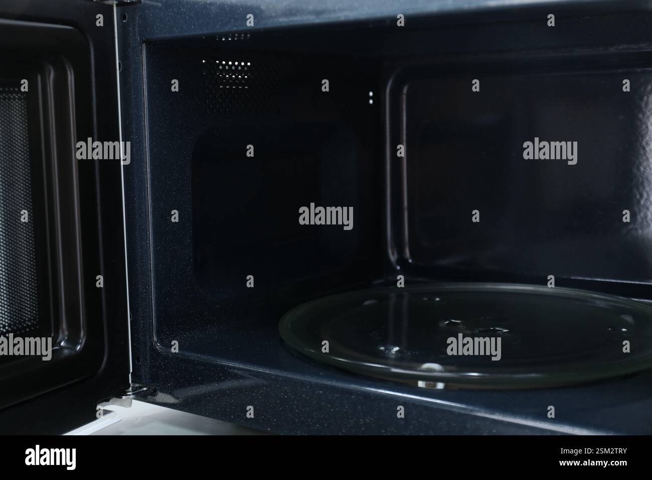 Open empty microwave oven, closeup. Inside view Stock Photo - Alamy