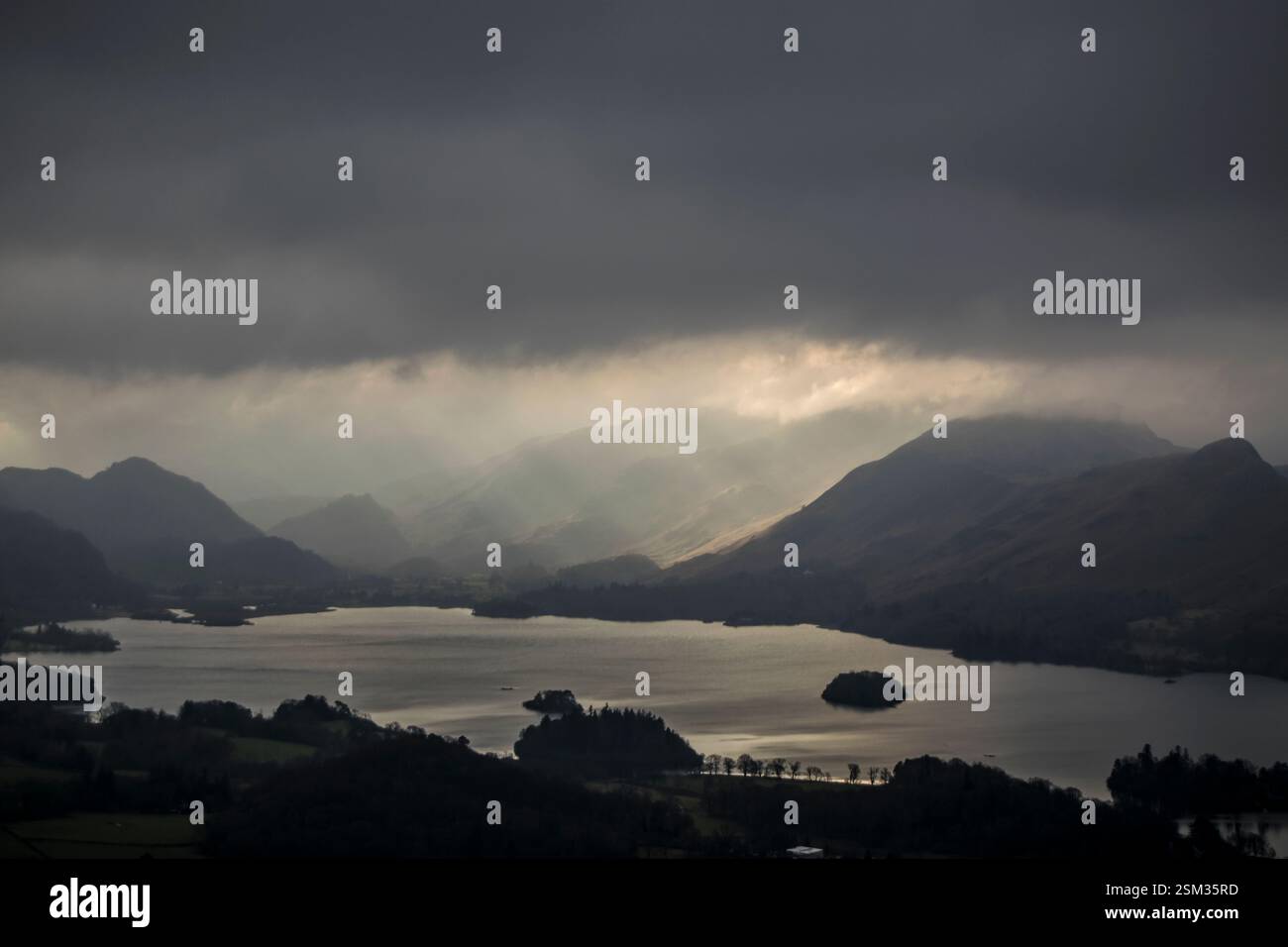 Dramatic landscape featuring a moody sky, dark storm clouds, and sun ...