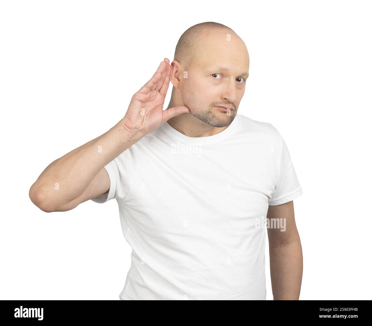 A Caucasian bald man wearing a white t-shirt is holding his hand to his ...