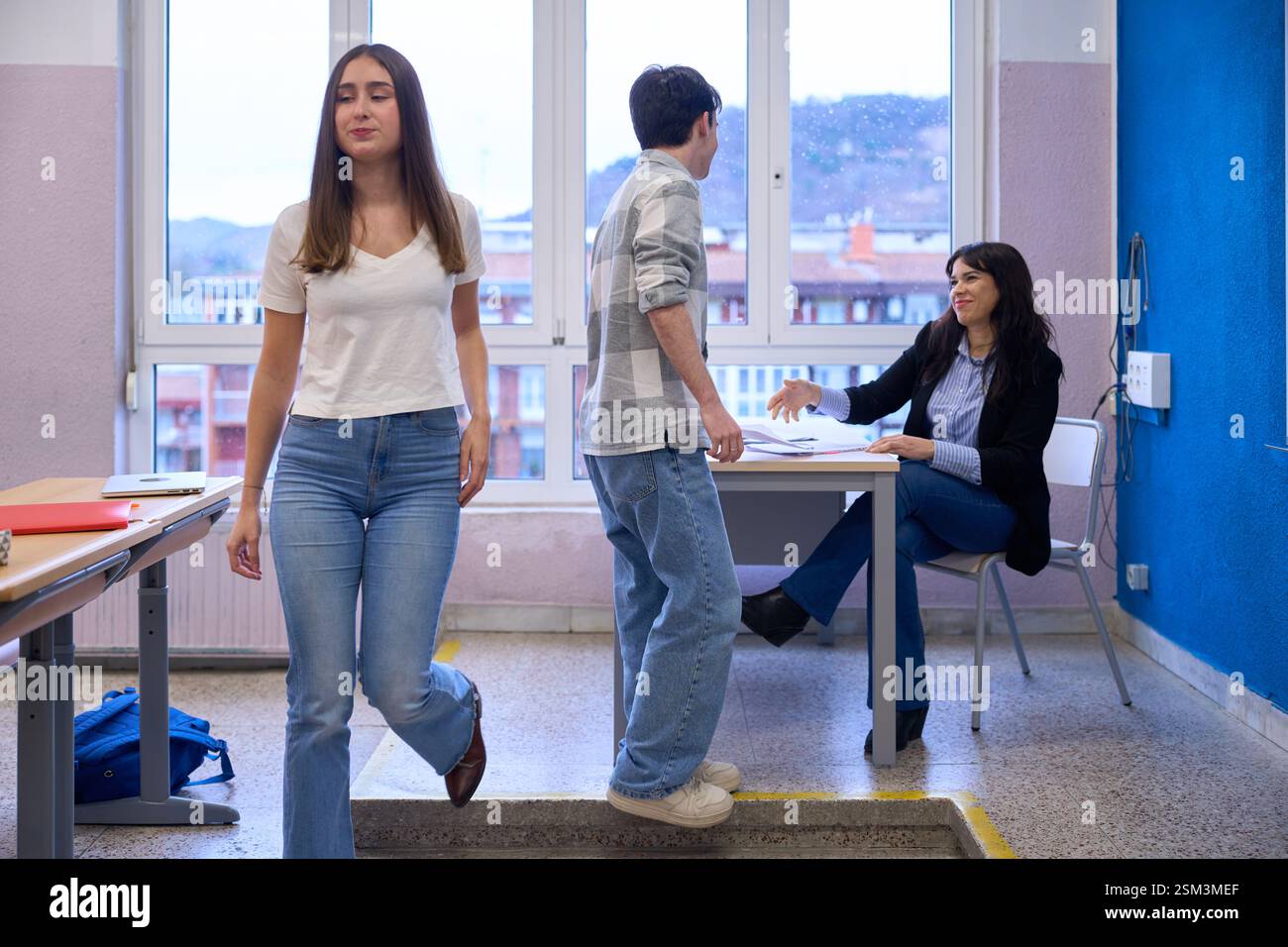 Student handing in homework hi-res stock photography and images - Alamy