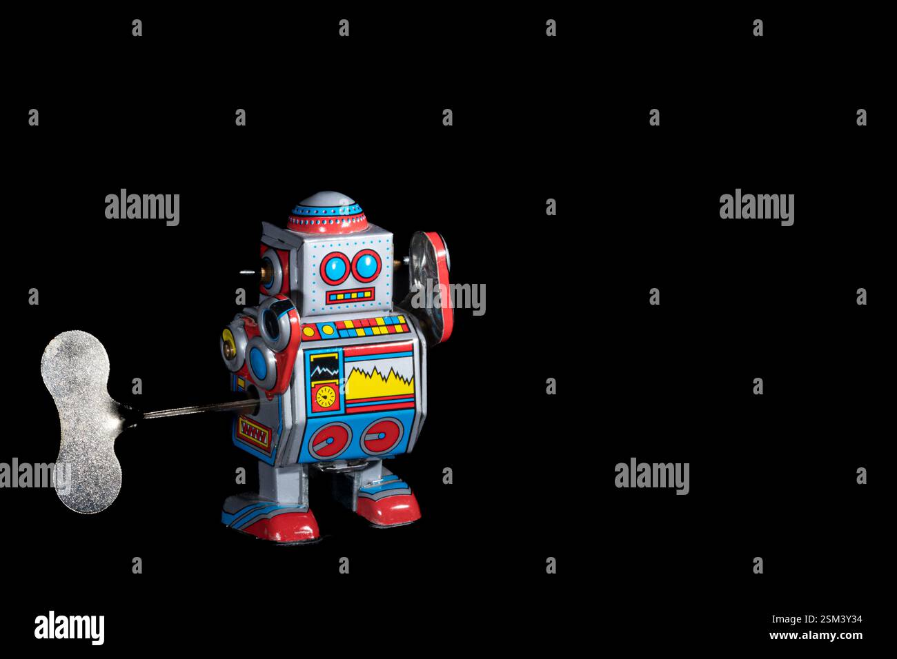 Classic retro-style toy robot with vibrant colors and wind-up mechanism ...