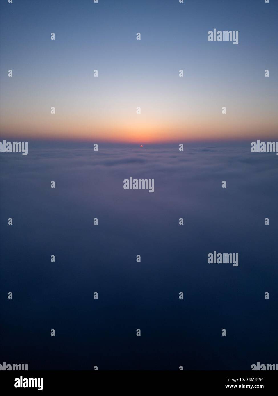 Aerial drone view above clouds at sunrise, high-altitude misty ...