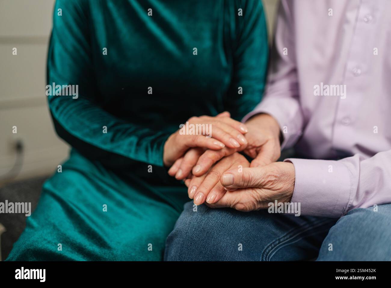 Old couple hands. Senior couple in love holding hands. Mid age old ...