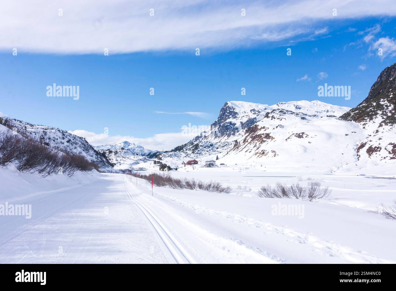 in winter closed inn Zeinisjoch, frozen and snow covered lake Vorbecken ...
