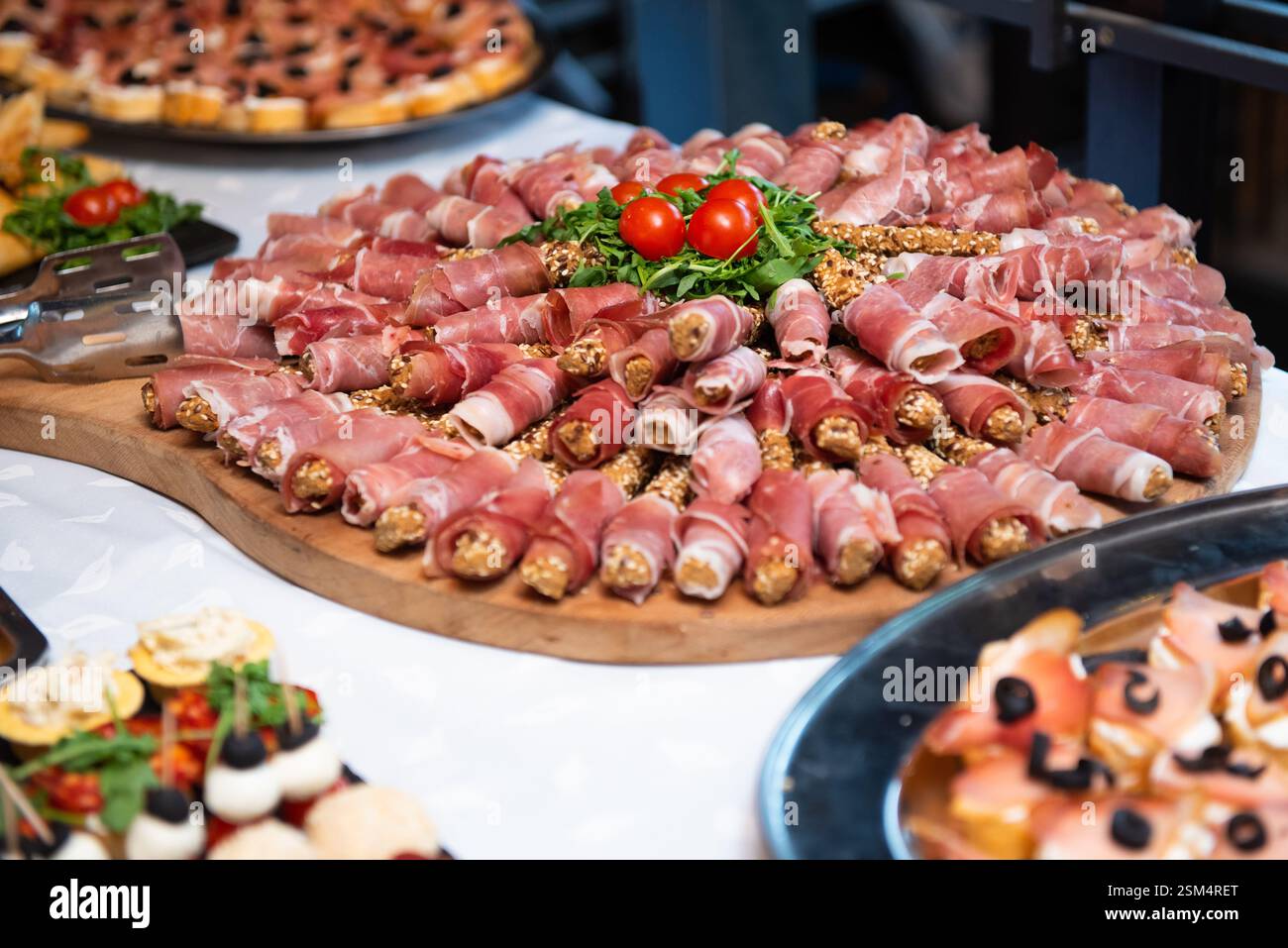 A stunning array of gourmet delicacies showcases tightly rolled meats ...