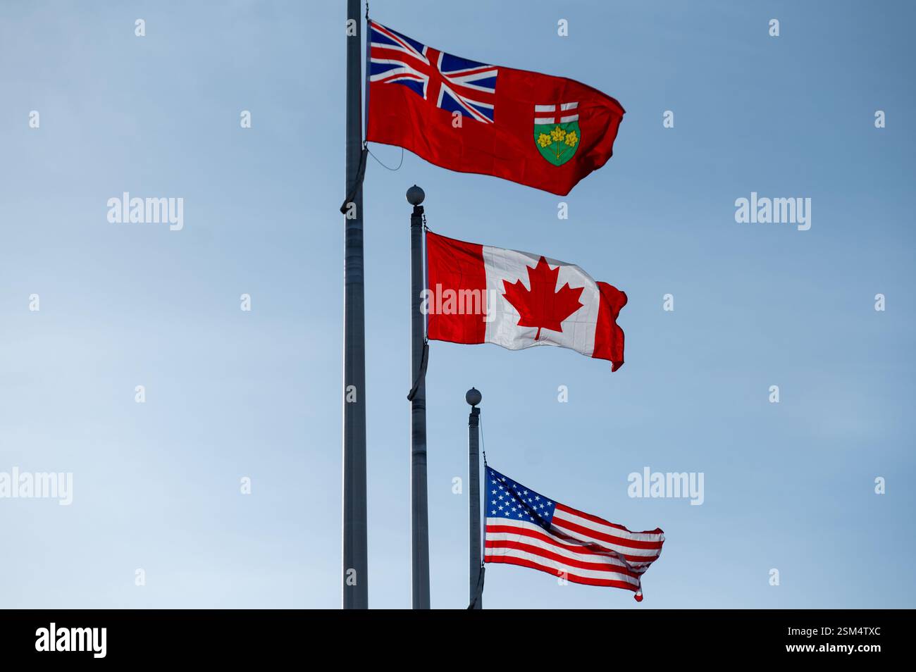 Lansdowne, Canada. 12th Feb, 2025. The Ontario, Canadian and U.S. flags ...