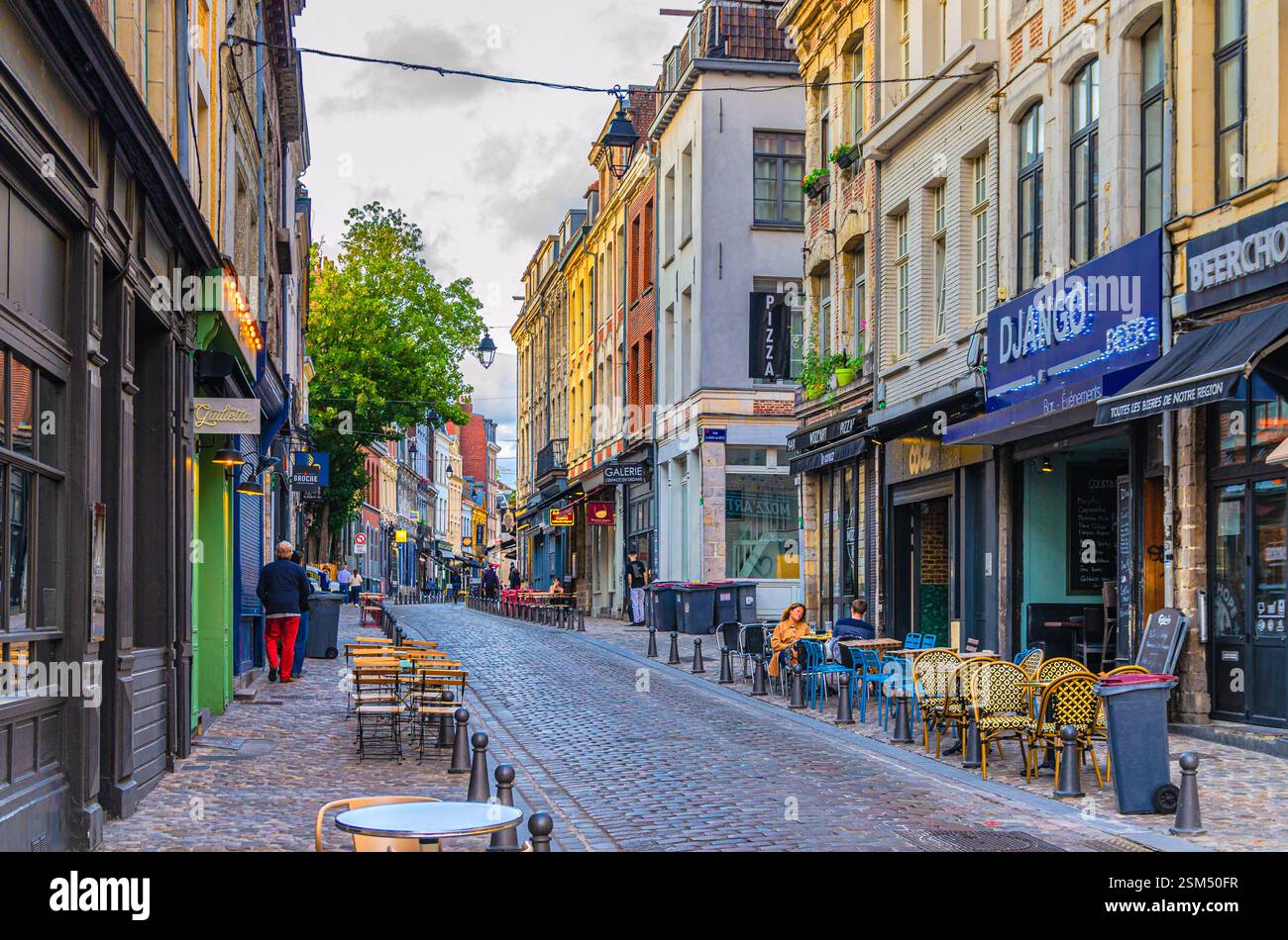 Lille, France, July 3, 2023: Street restaurant with tables and chairs ...