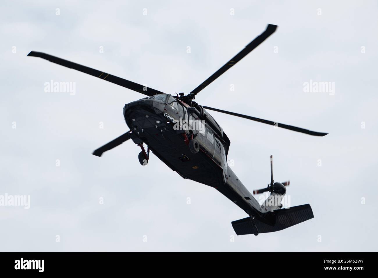 An RCMP Sikorsky UH-60 Black Hawk helicopter lands at the Canada Border ...
