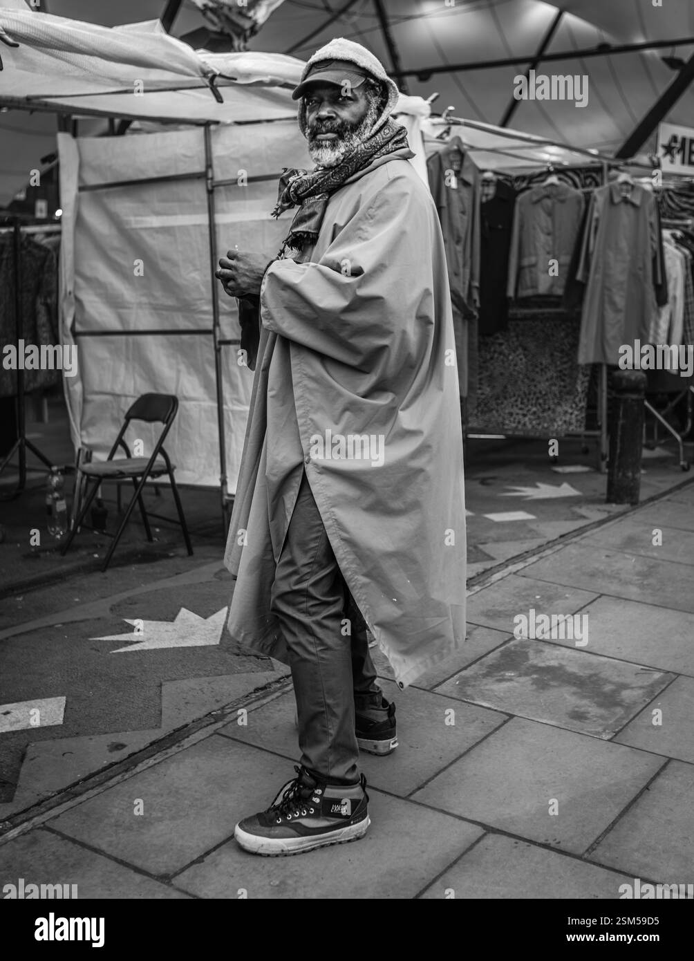 A black and white image of a market worker at the Portobello Market in ...