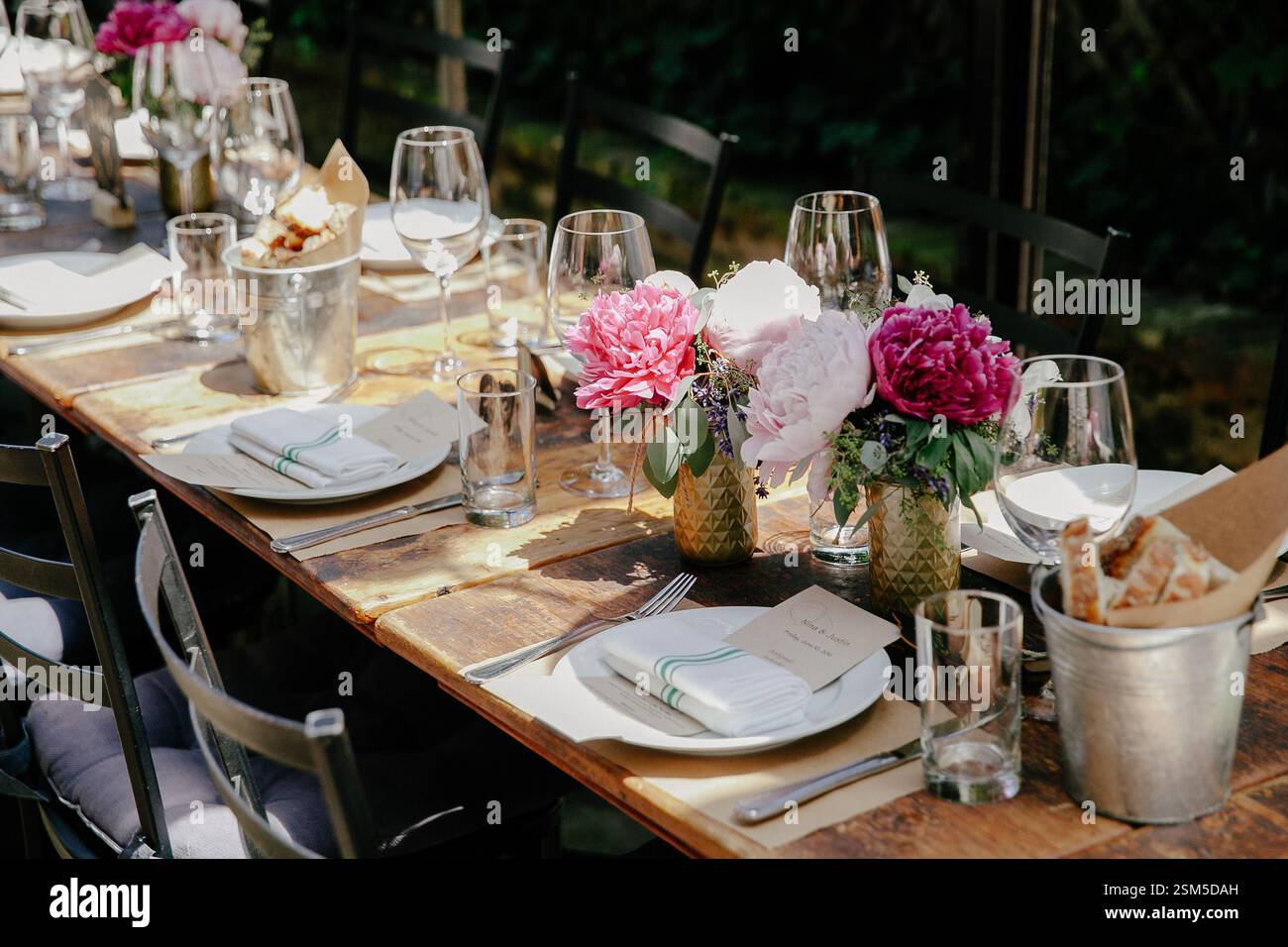 A stunning dining table with floral centerpieces and crystal glassware ...