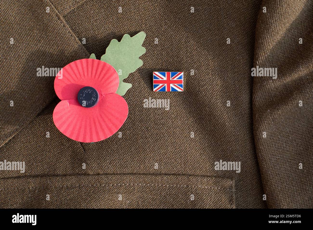 remembrance day poppy on a uniform Stock Photo - Alamy