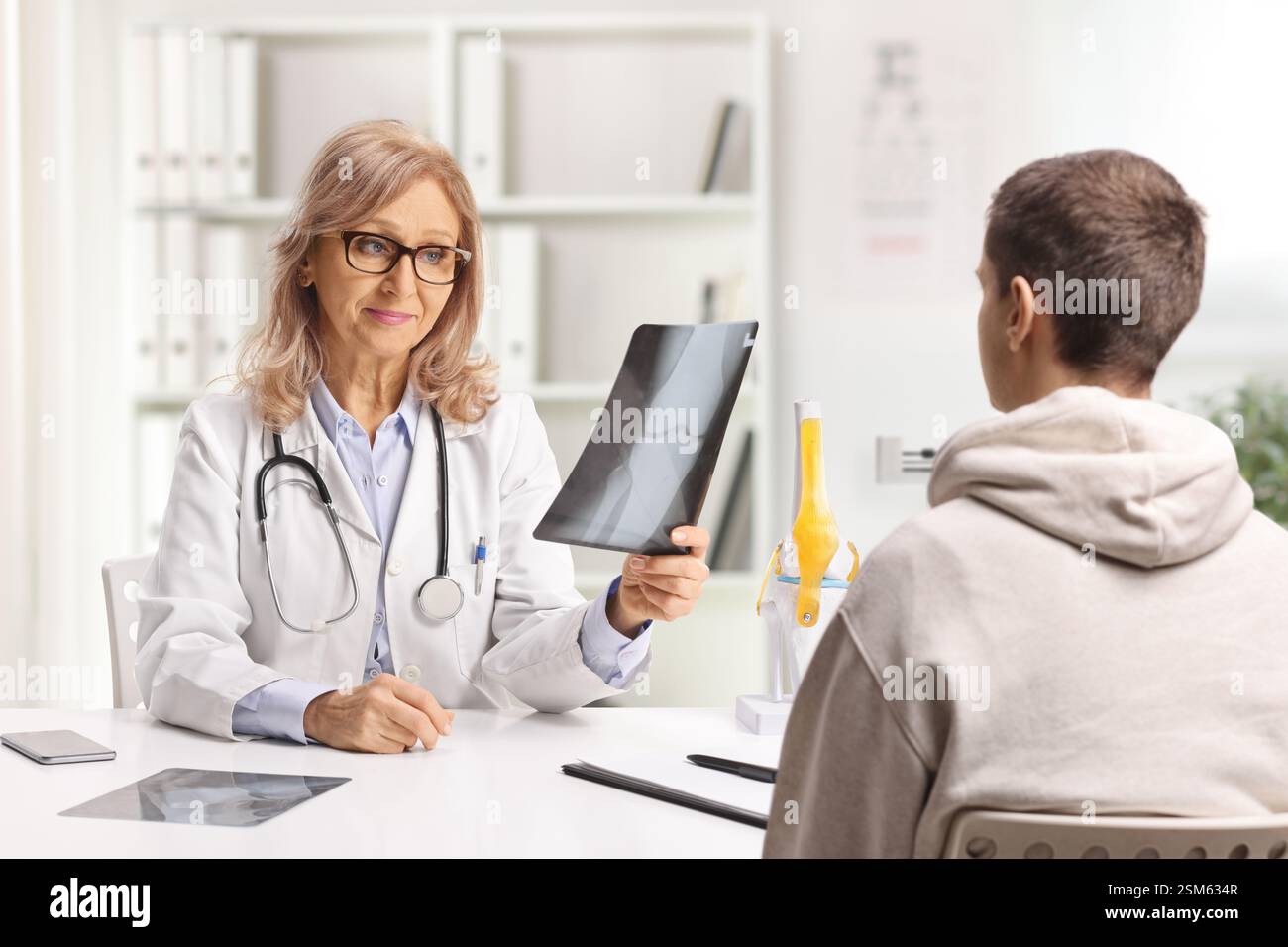 Doctor patient consultation from behind hi-res stock photography and ...