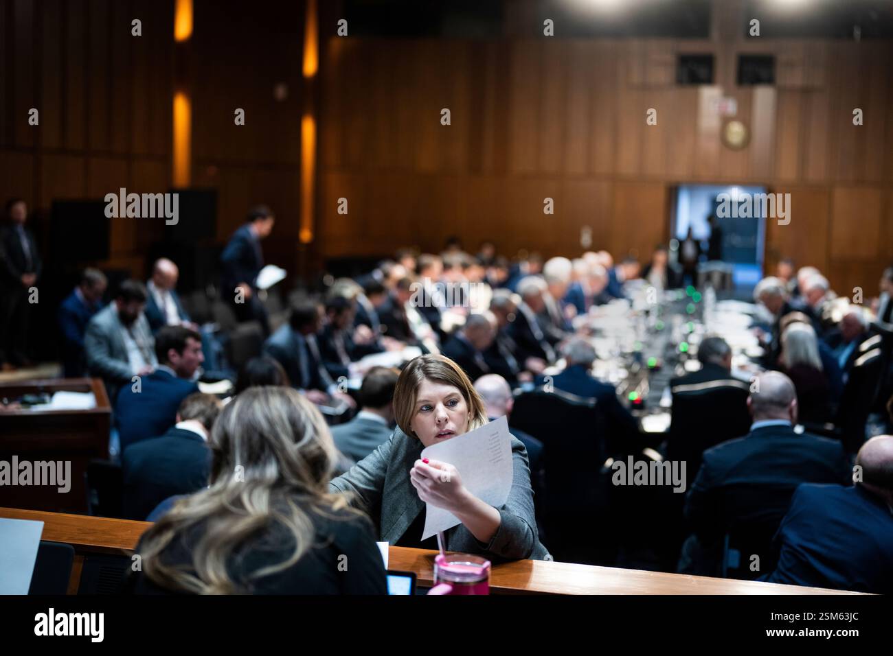 UNITED STATES - FEBRUARY 12: An aide works during the Senate Budget ...