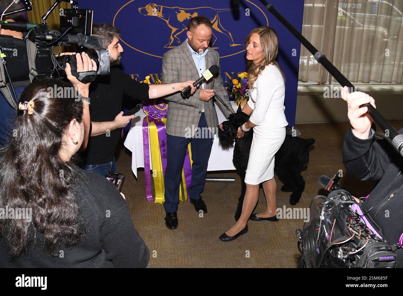 New York, USA. 12th Feb, 2025. Handler and co-owner Katie Bernardin (r ...