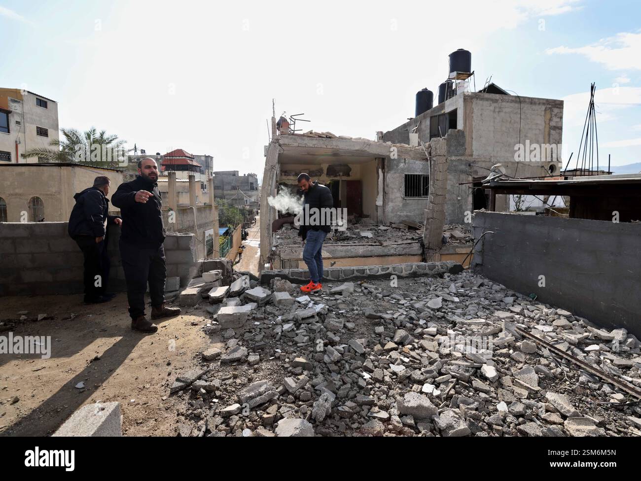 Tubas. 12th Feb, 2025. Palestinians check the damage after an Israeli ...