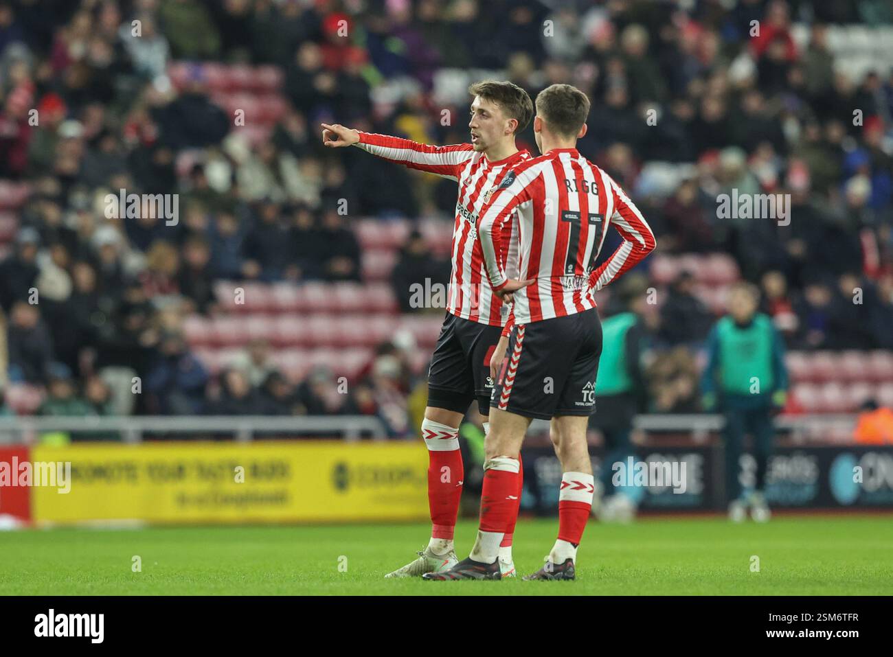 Dan Neil of Sunderland speaks to Chris Rigg of Sunderland during the ...