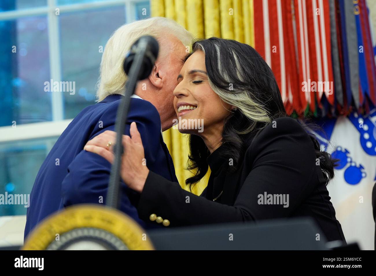 President Donald Trump congratulates Tulsi Gabbard after she was sworn ...