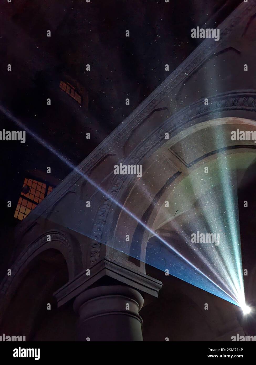 Vibrant rainbow projector spotlight casting a colorful light beam in a ...