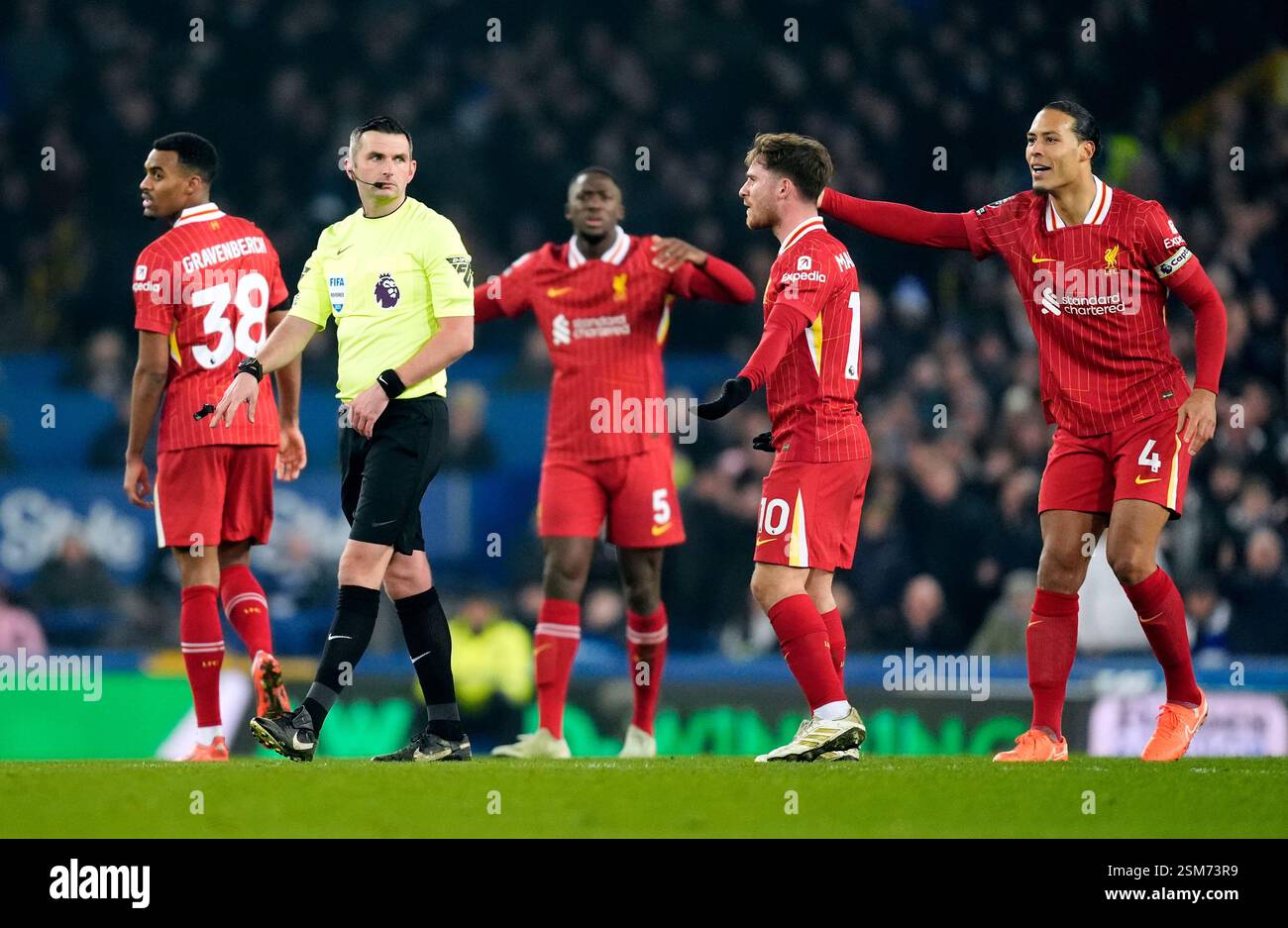 Liverpool players react after referee Michael Oliver stops play during ...