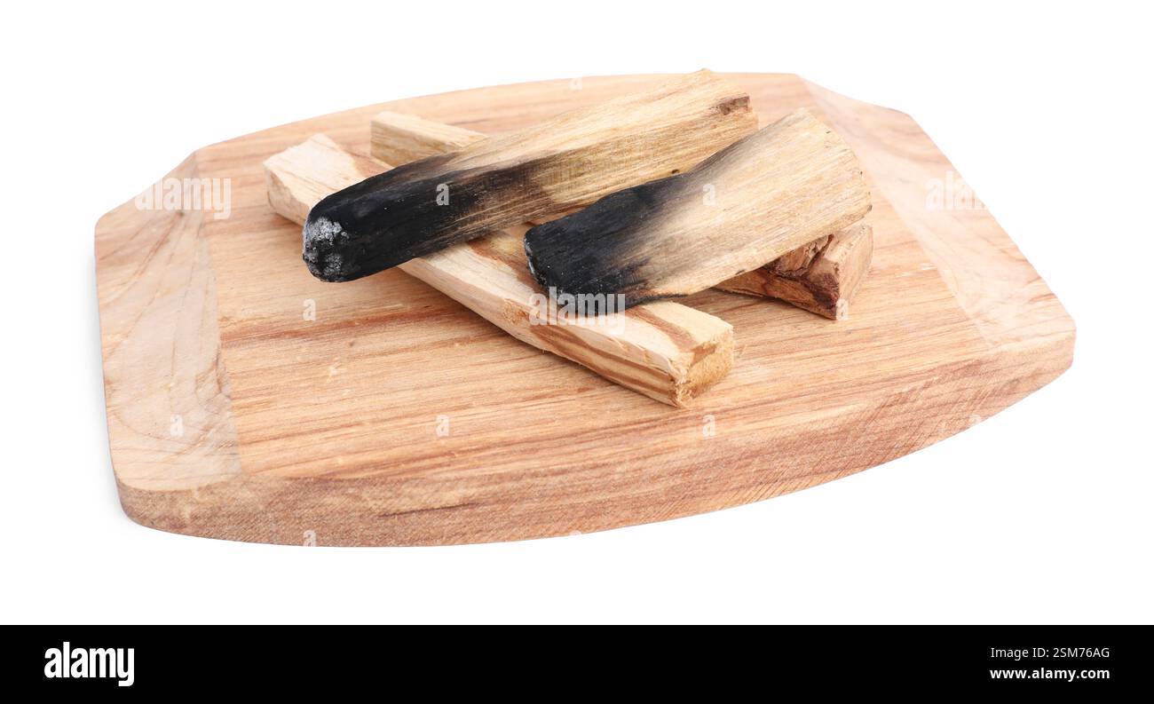 Whole and burnt palo santo sticks on white background Stock Photo - Alamy