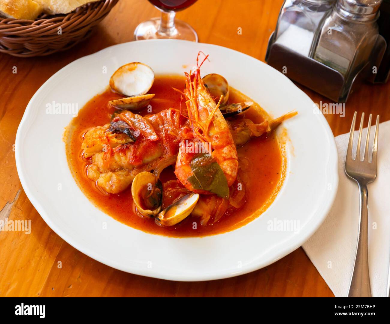 Tail of monkfish with shellfish, prawns Stock Photo - Alamy
