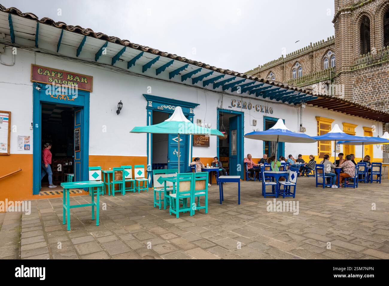 Cafes in colourful colonial building on the main plaza, Jardin ...